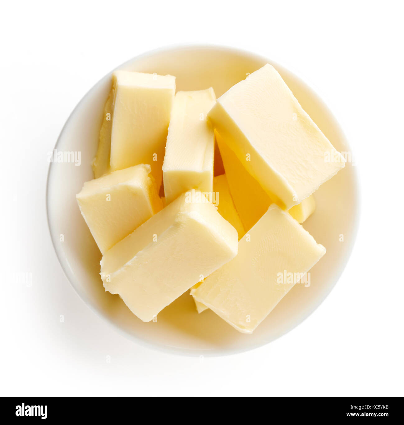Butter pieces in bowl isolated on white background, top view Stock ...
