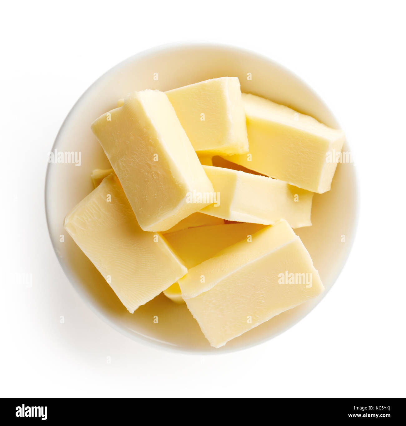 Butter pieces in bowl isolated on white background, top view Stock ...