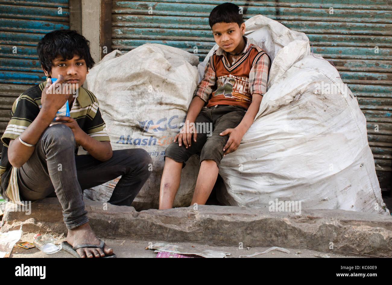 NEW DELHI, INDIA - 23 APRIL 2016 : portrait of two Indian boys sitting ...