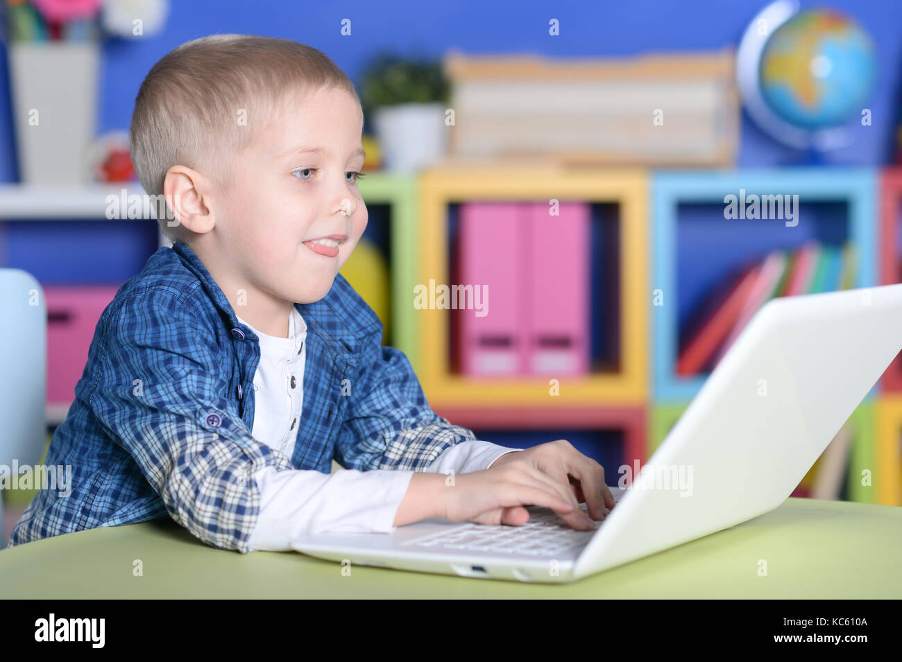 boy using laptop Stock Photo - Alamy