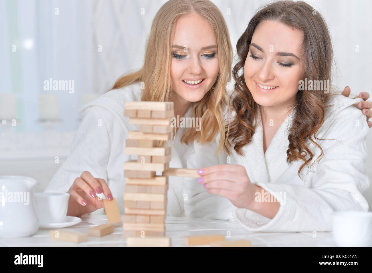 women playing with blocks Stock Photo - Alamy