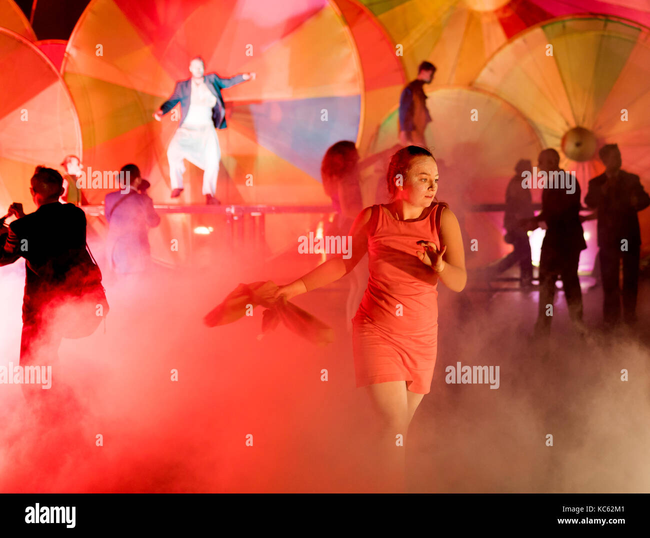 The Colour of Light street performance, dancers and acrobats against a ...