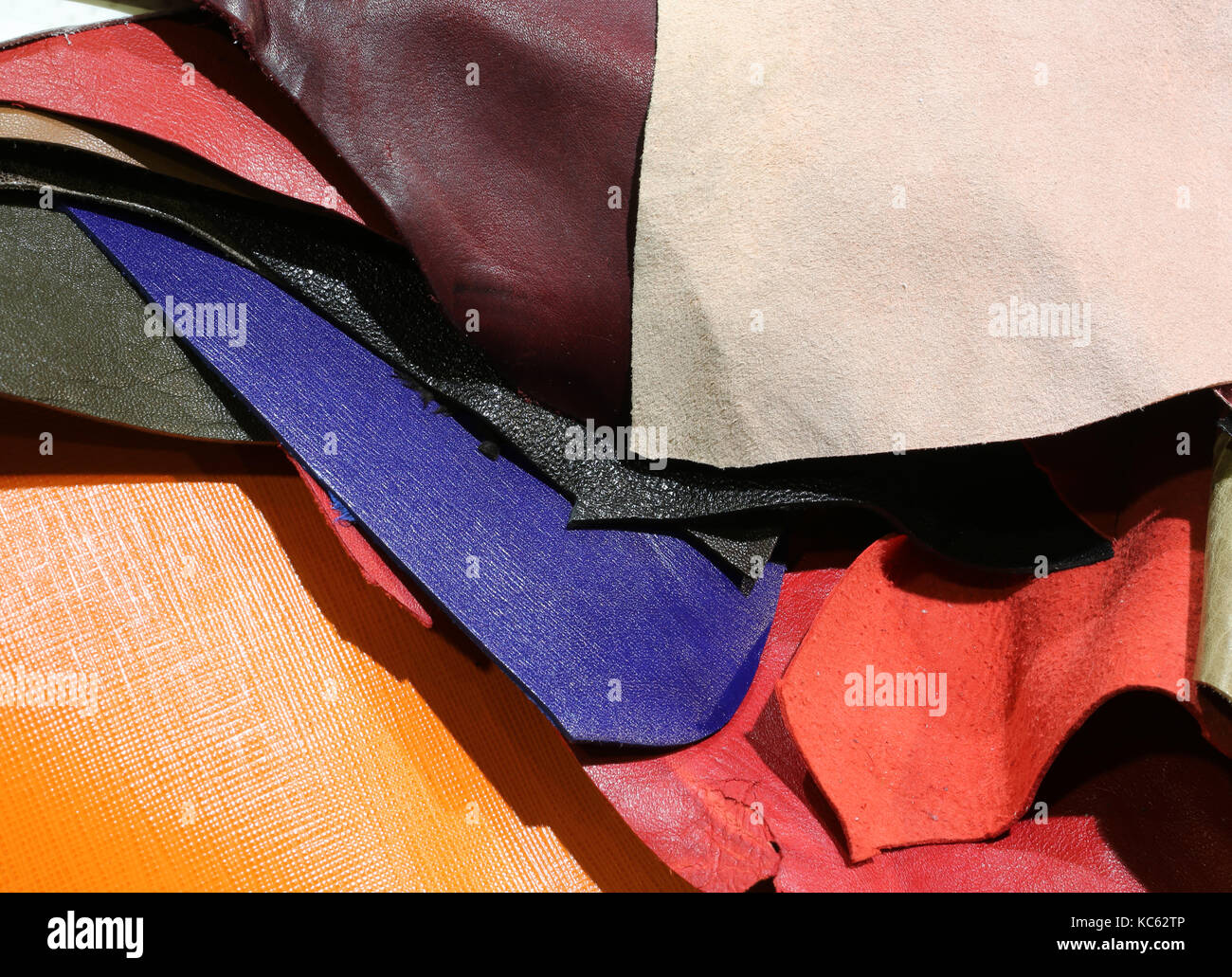 Background of pieces of real leather in many colors craft store ...