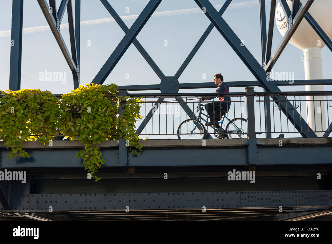 silhouette of person on bridge overhead Stock Photo - Alamy