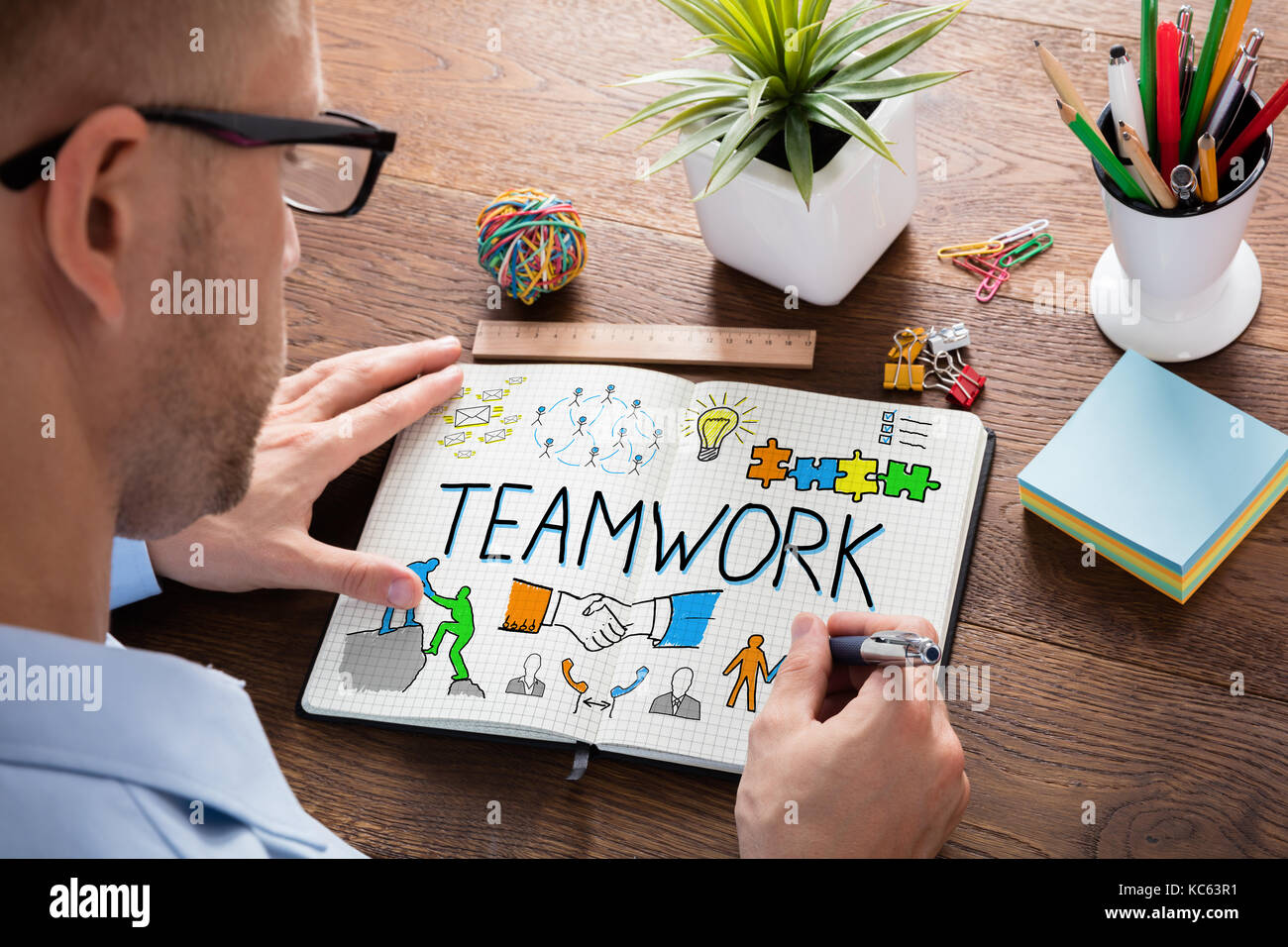 Close-up Of A Person Working On Teamwork Concept On Notebook Stock ...