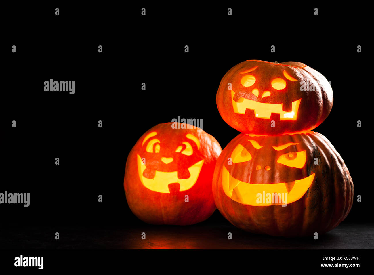 Three halloween Jack O' Lantern pumpkins Stock Photo - Alamy