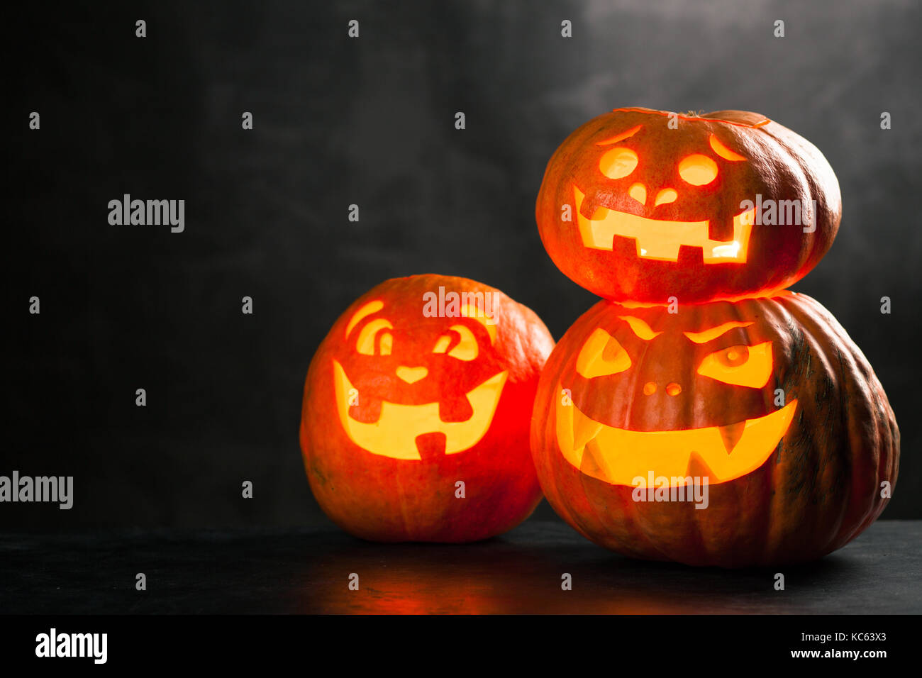 Three halloween Jack O' Lantern pumpkins Stock Photo - Alamy