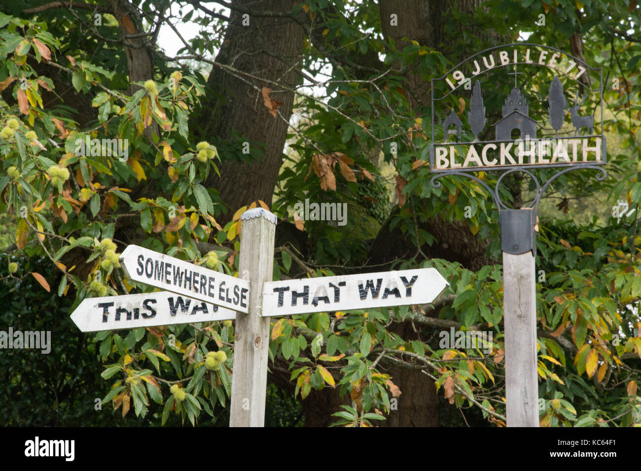 Humorous signpost in Blackheath village, Surrey, UK. Road sign reading ...