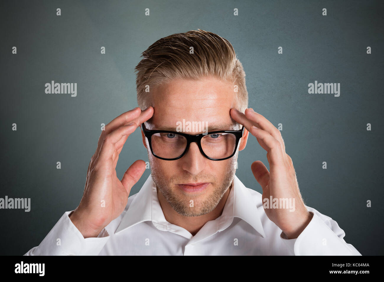 Portrait Of A Young Stressed Businessman Having Head Ache Stock Photo ...