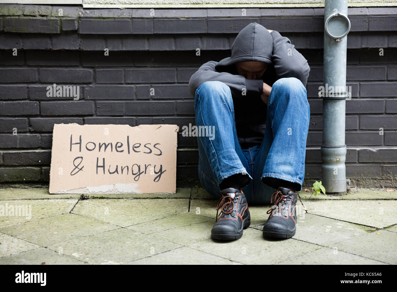Homeless And Hungry Man Sitting On Street With Signboard Stock Photo ...