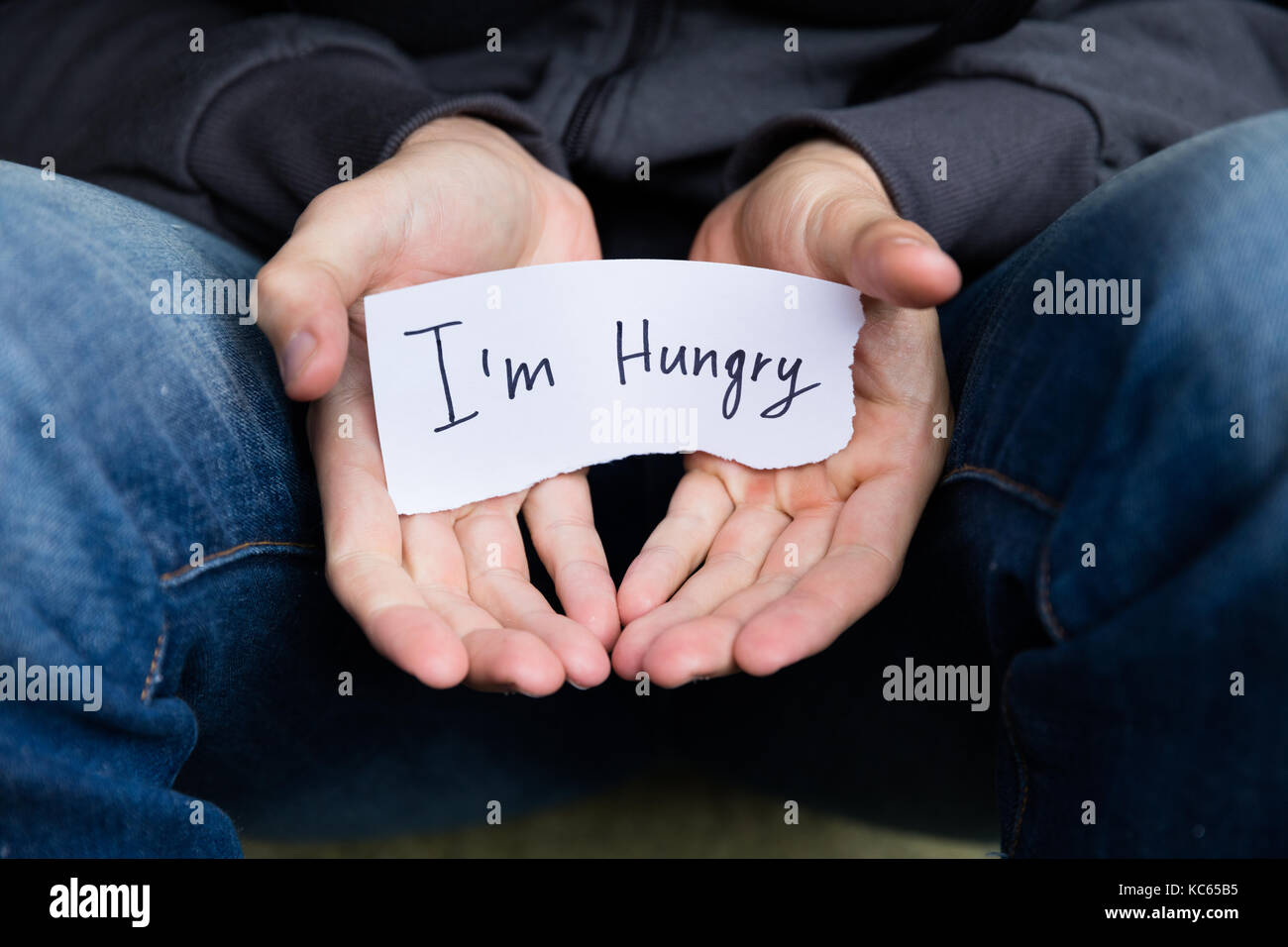Piece Of White Paper With The Text I Am Hungry In Man's Hand Stock ...