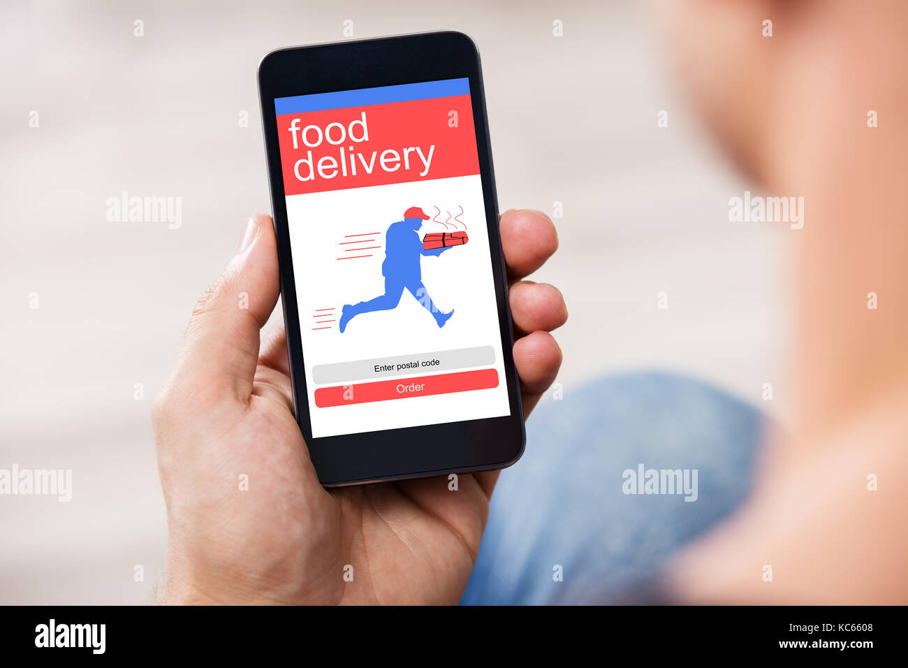 Close-up Of A Man's Hand Holding Smart Phone Showing Food Delivery ...