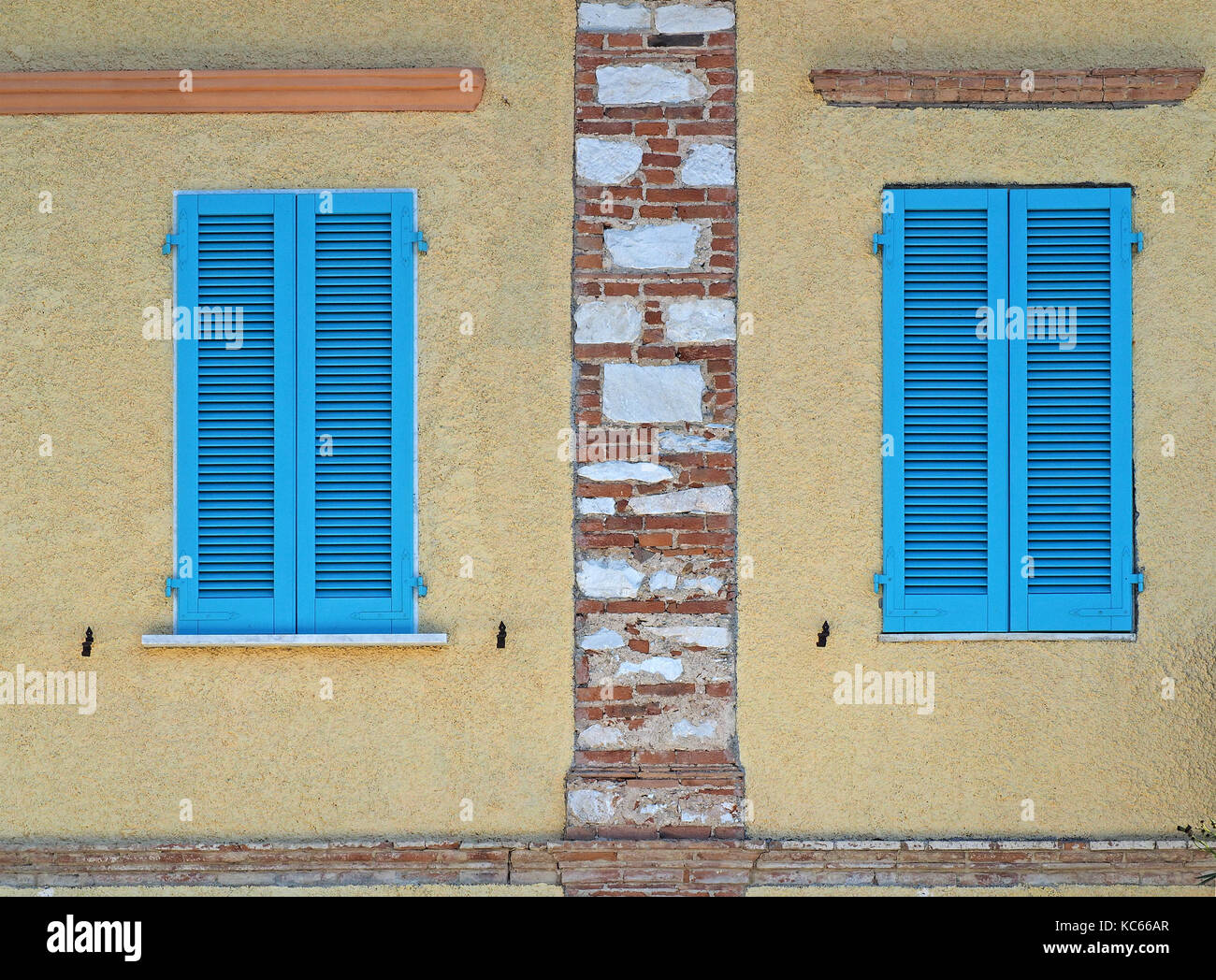 residential building with traditional wooden shutters painted bright ...