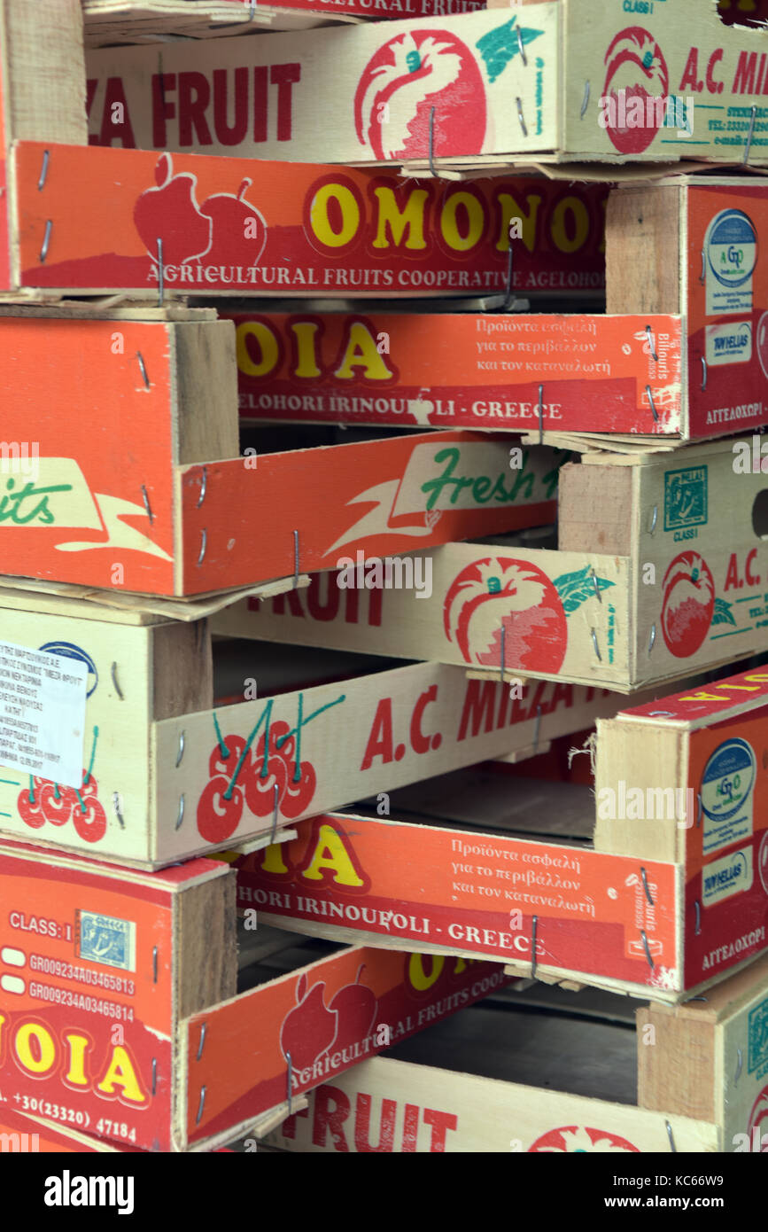 Fresh fruit market packaging and crates stacked up in a regular ...