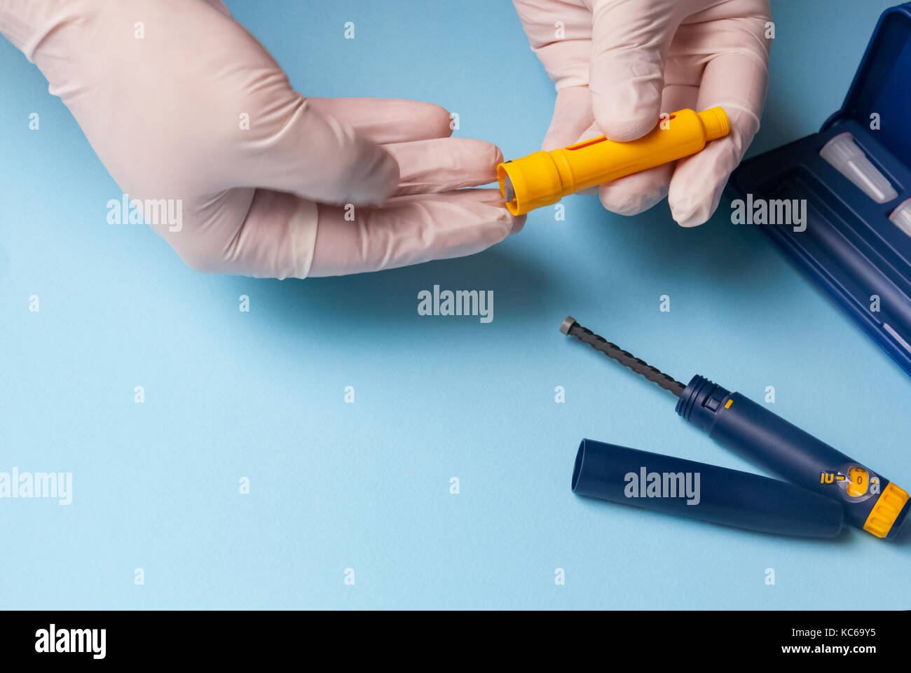 A man holds a syringe for subcutaneous injection of hormonal drugs in ...