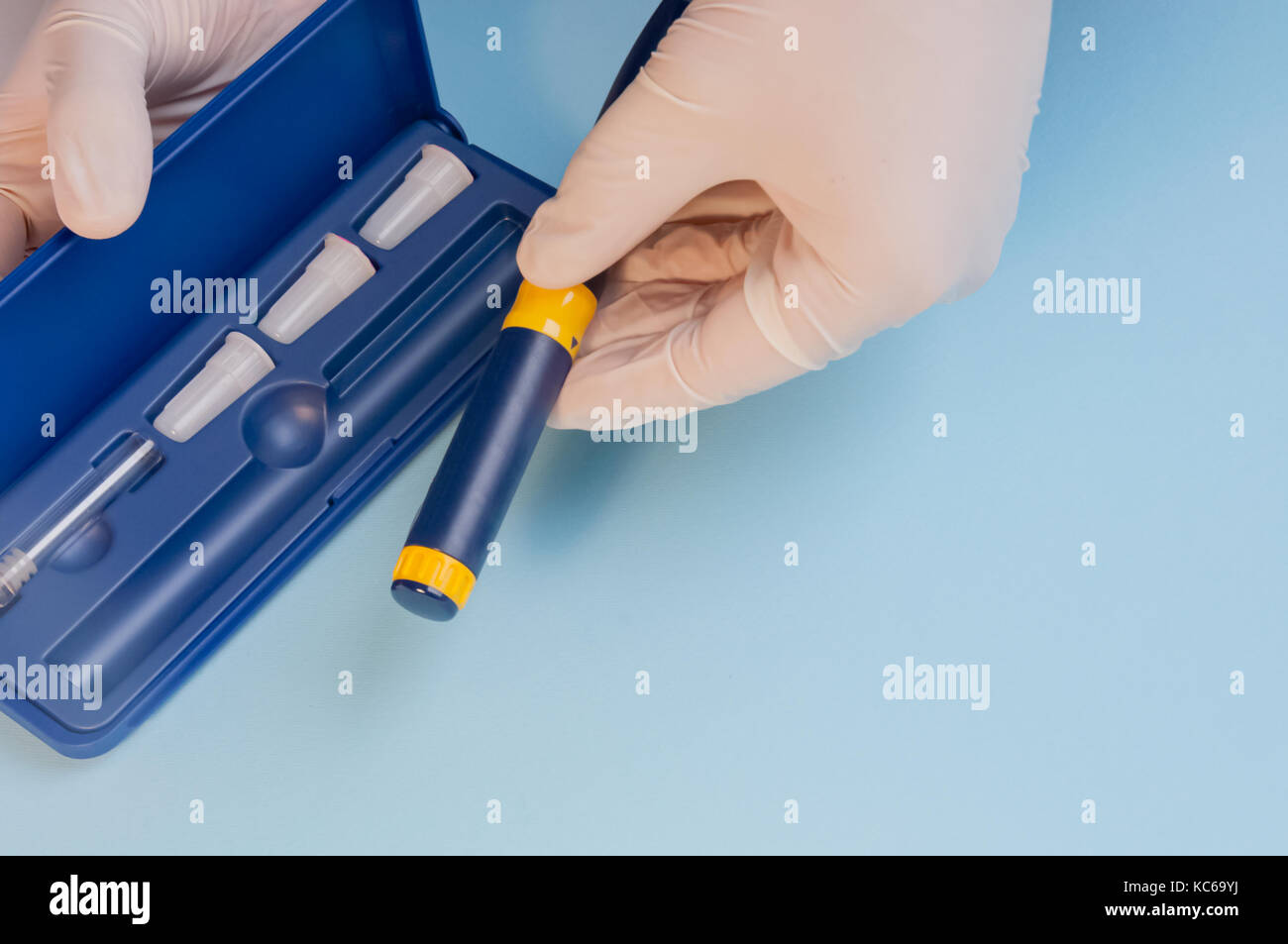 A man holds a syringe for subcutaneous injection of hormonal drugs in ...