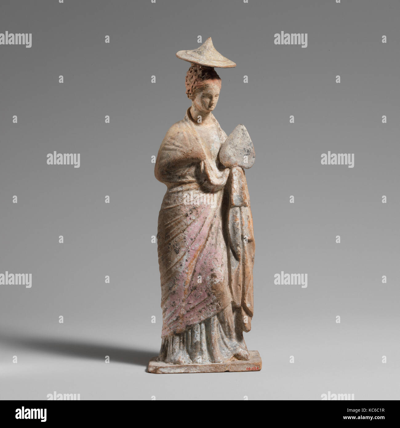Terracotta statuette of a draped, standing woman, 3rd century B.C Stock ...