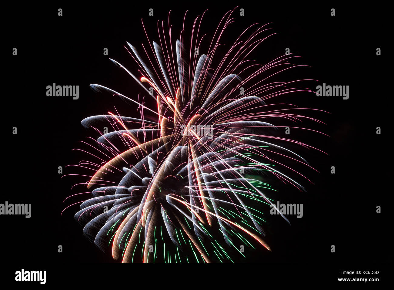 Bright fiery fireworks pyrotechnic display in a nigh sky for New Year ...