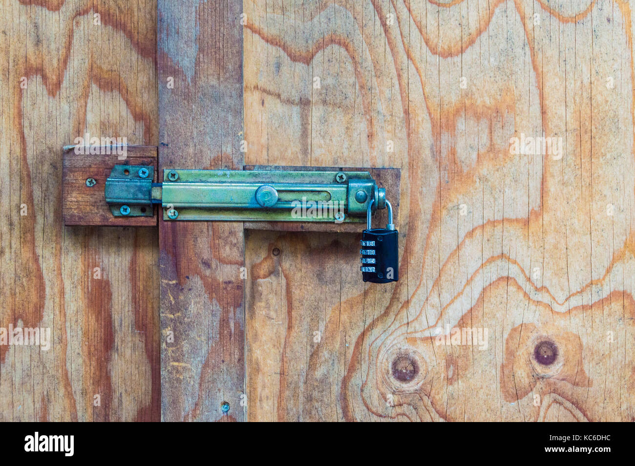 padlock with combination on an old wood door Stock Photo - Alamy