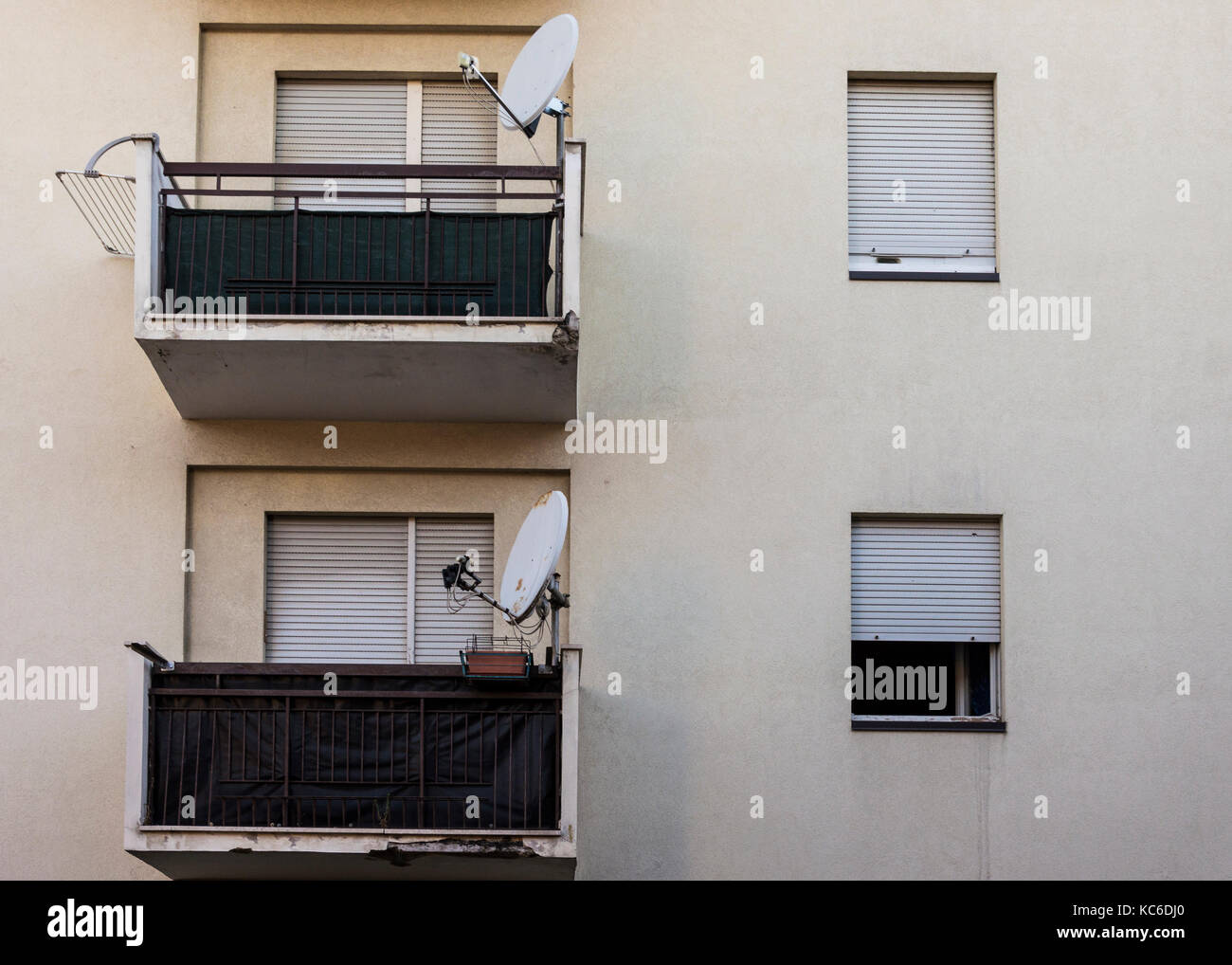 Satellite dish at a very old and slovenly house Stock Photo - Alamy