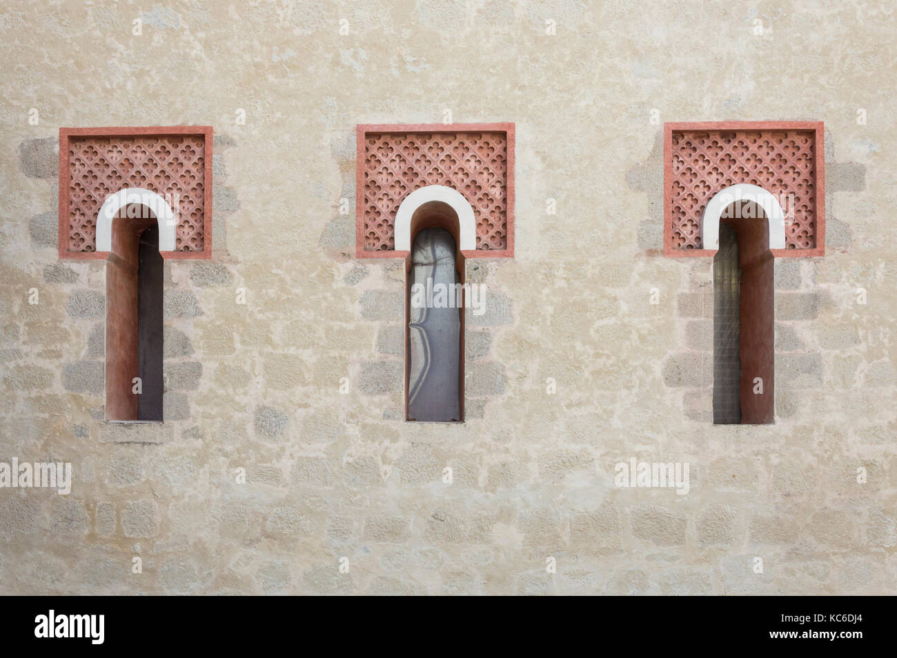 Three front glass small windows of an old medieval house Stock Photo ...