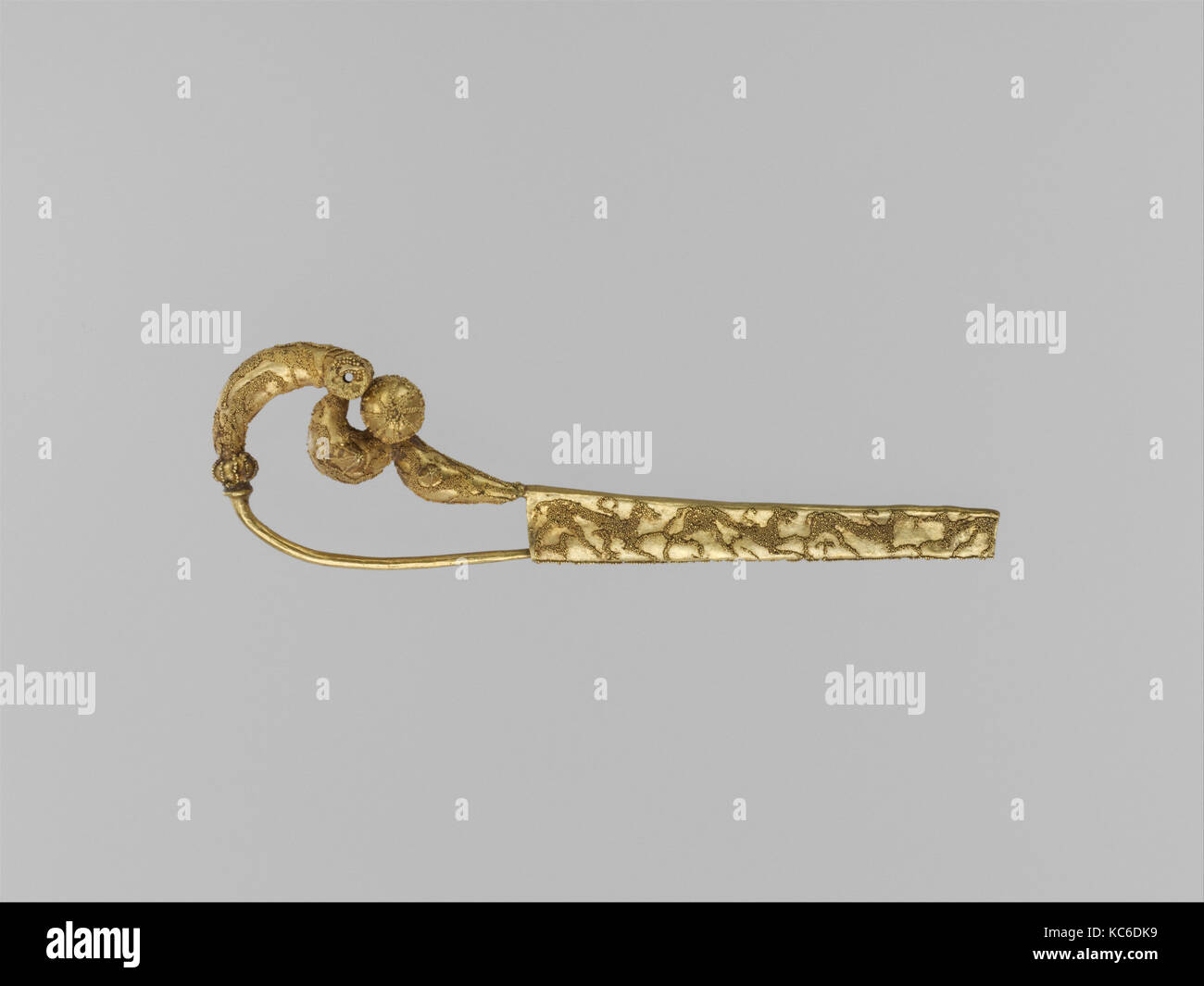 Gold serpentine fibula (safety pin) with animals in granulation, 7th ...