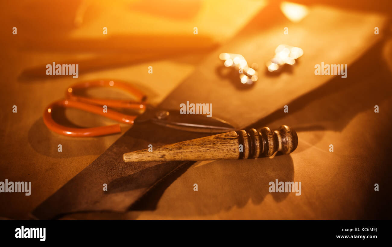 Working process of the leather belt in the leather workshop. Tanner in ...