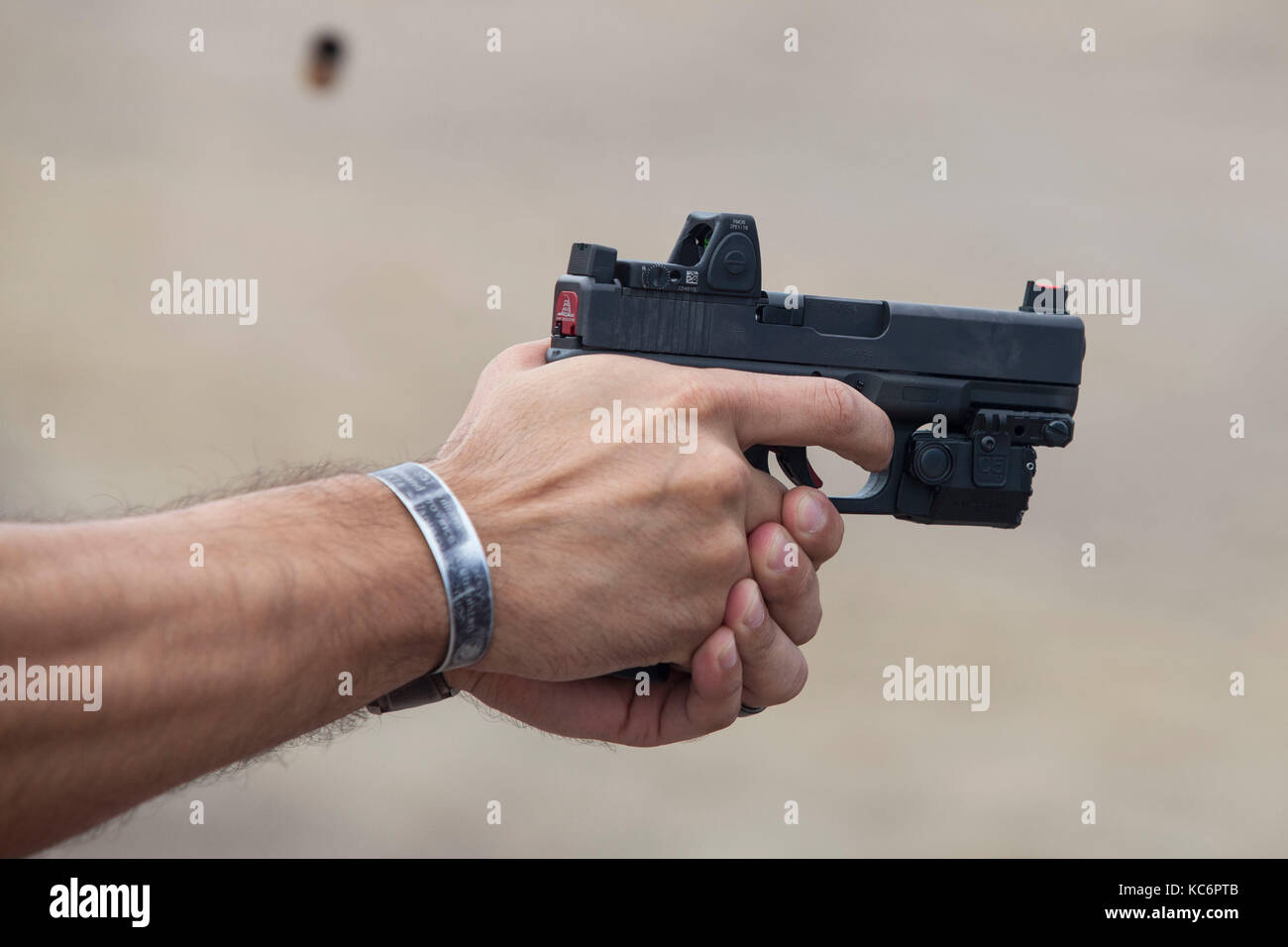 Firing a Pistol Stock Photo - Alamy