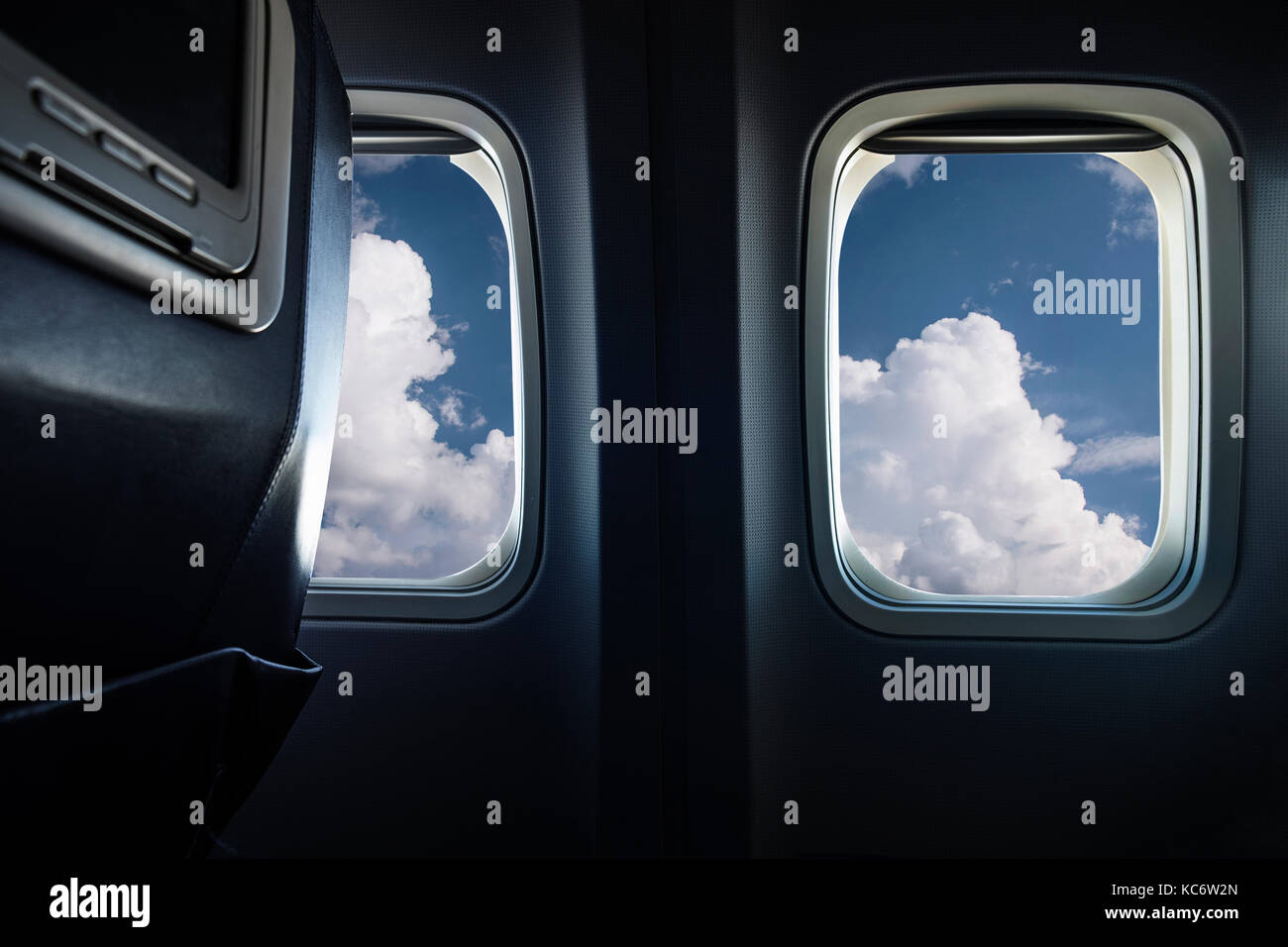 Clouds behind airplane window Stock Photo - Alamy