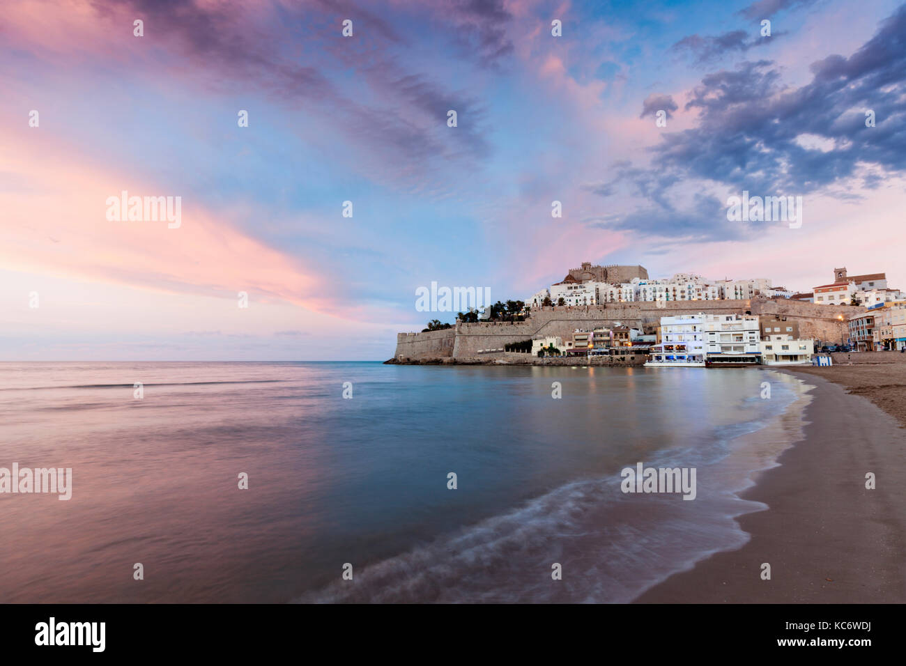 Spain, Valencian Community, Peniscola, Waterfront town at sunset Stock ...