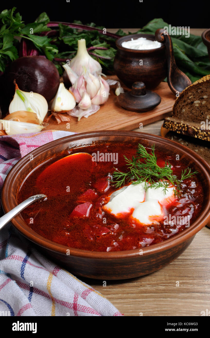 Borscht-vegetable beetroot soup, on the table with slices of rye cereal ...