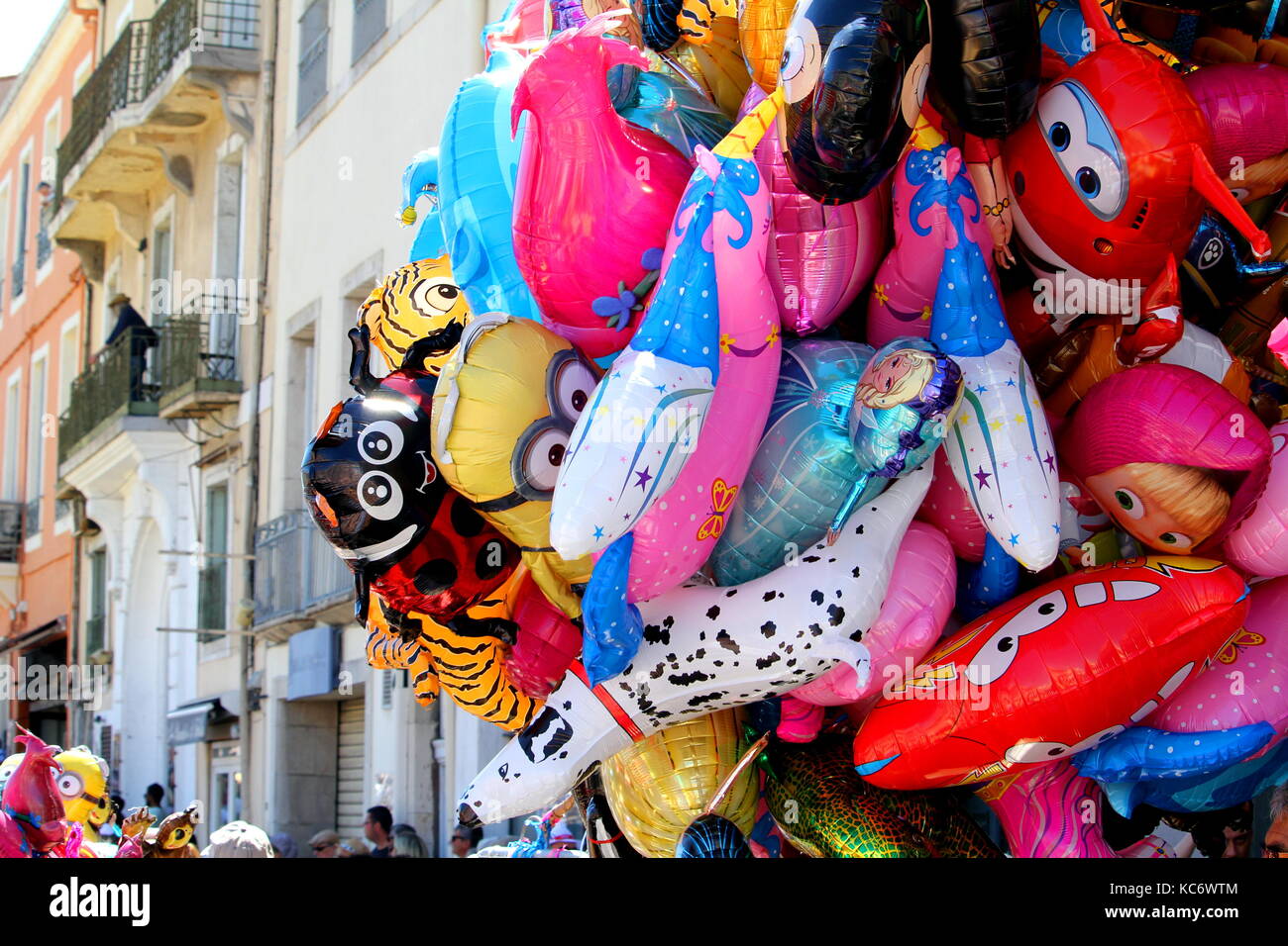 Big bunch of brightly coloured helium balloons with various branded ...
