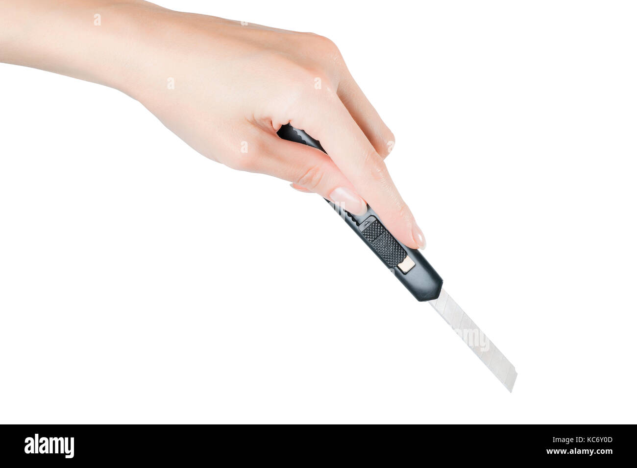 Woman hand cutting something with paper knife. Isolated on white ...