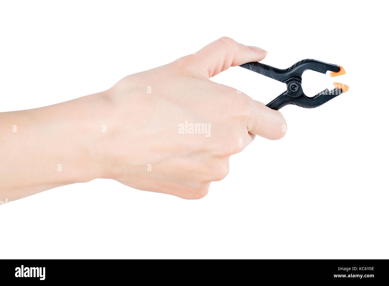 Woman hand holding black open clamp. Isolated on white, clipping path ...