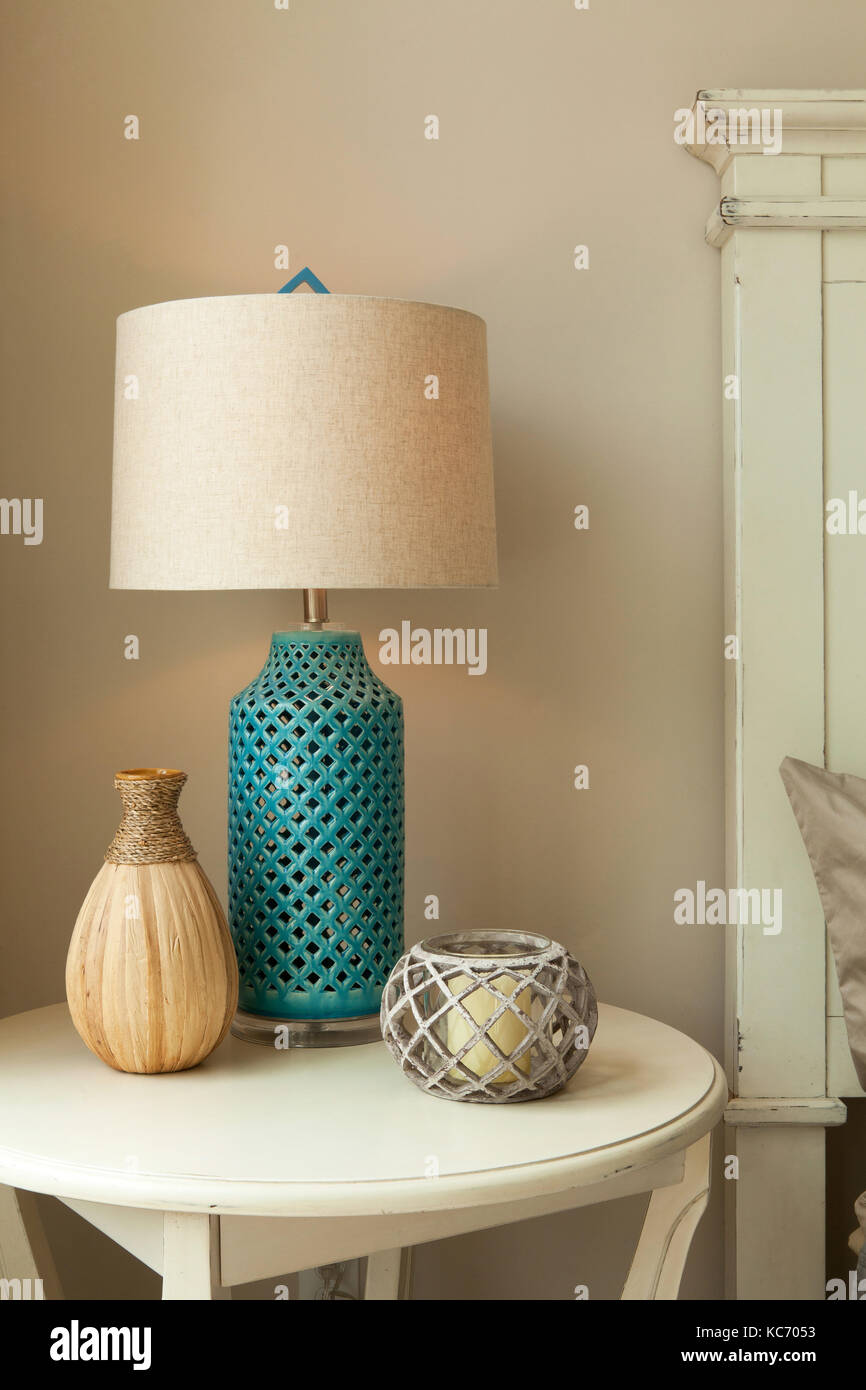 Lamp on table in bedroom Stock Photo - Alamy