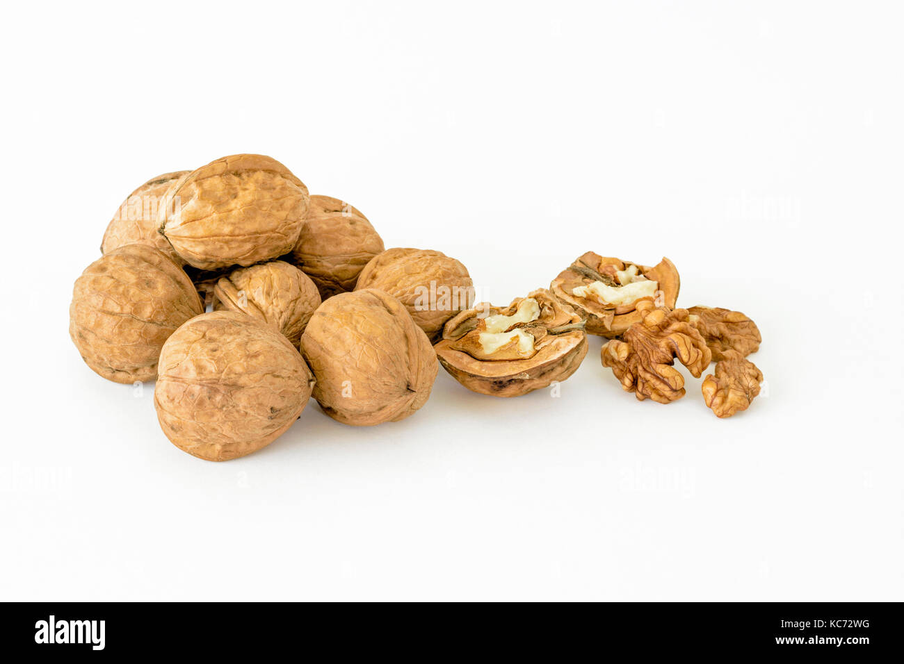 Whole and shelled walnuts and kernel on a white background Stock Photo ...