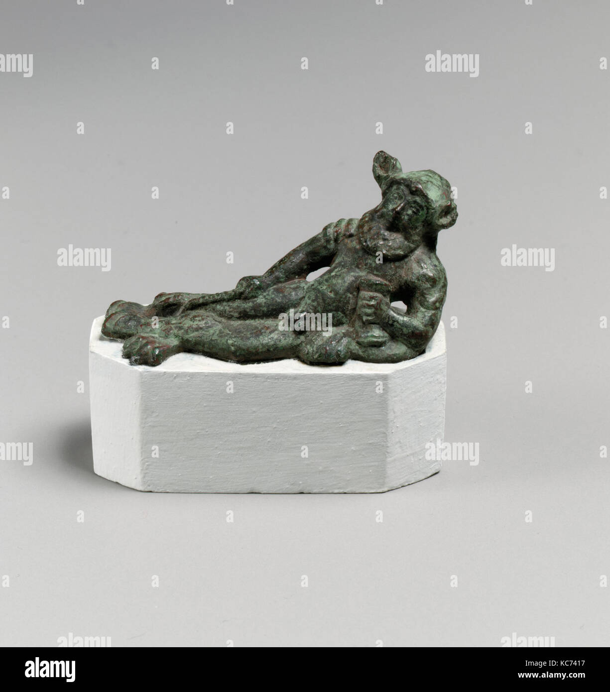 Bronze statuette of a satyr reclining on a lion's skin, early 5th ...