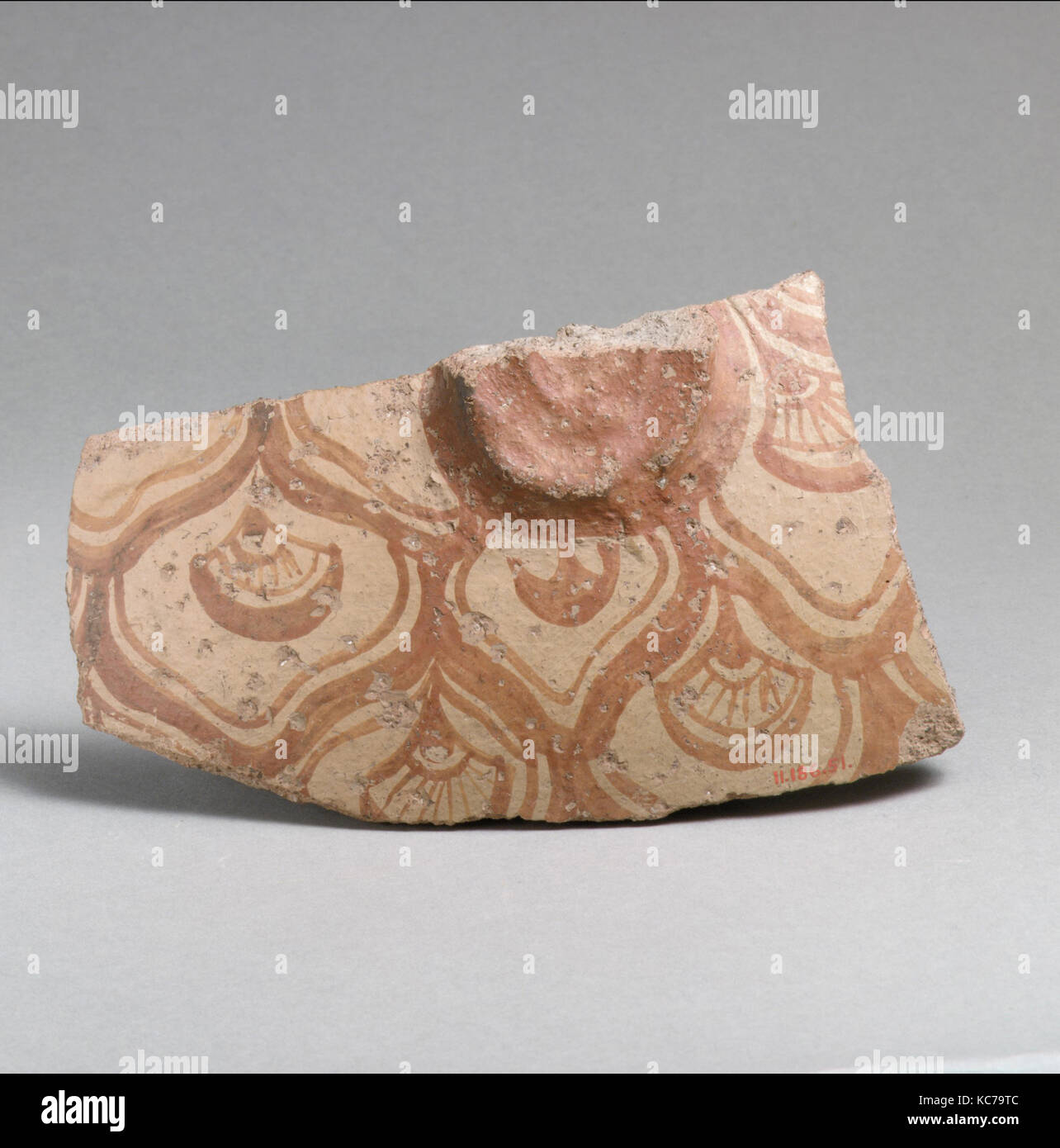 Terracotta vessel fragment with reticulated pattern enclosing ...