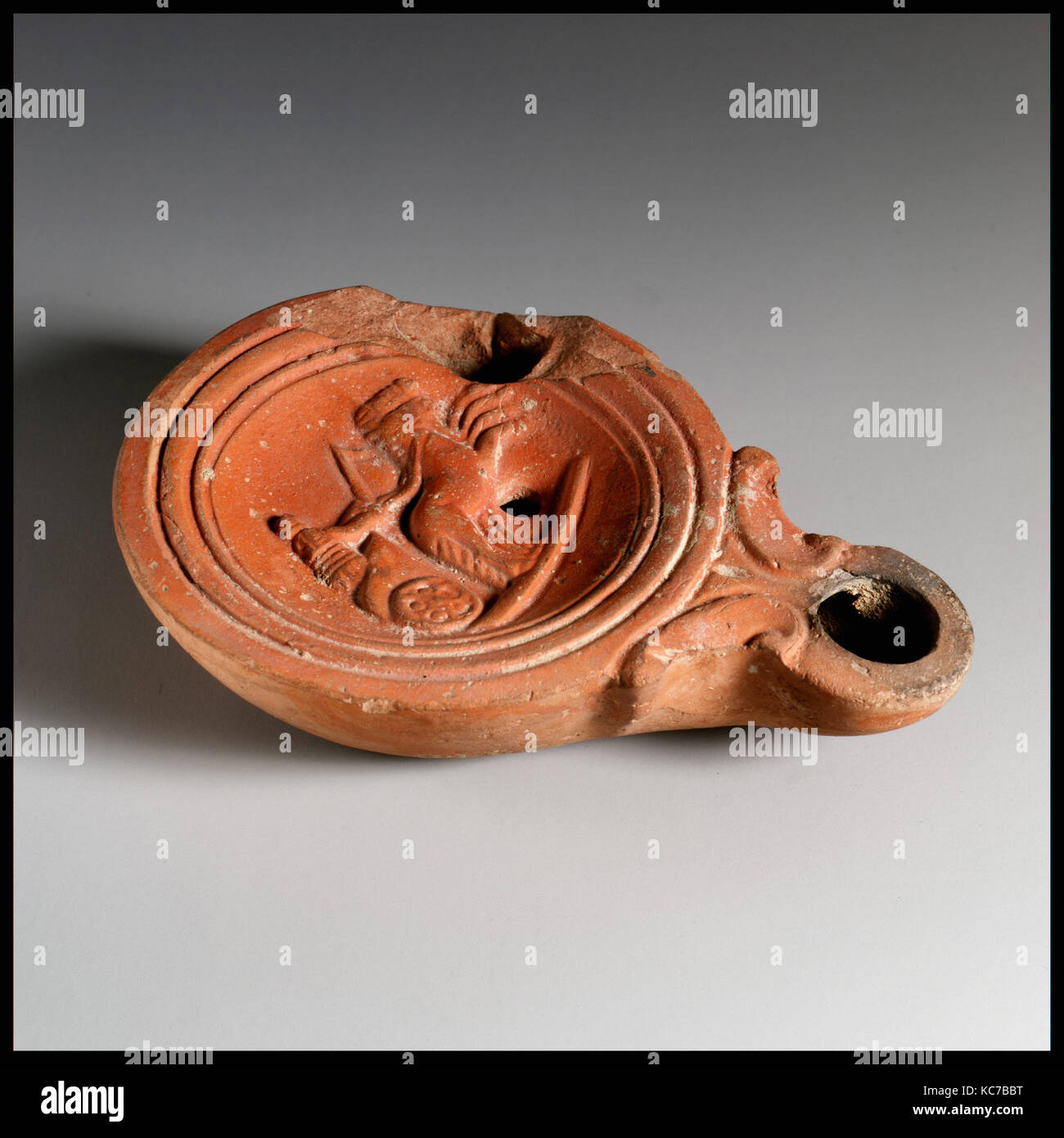 Terracotta lamp, ca. A.D. 70–120, Roman, Cnidian, Terracotta; mold-made ...