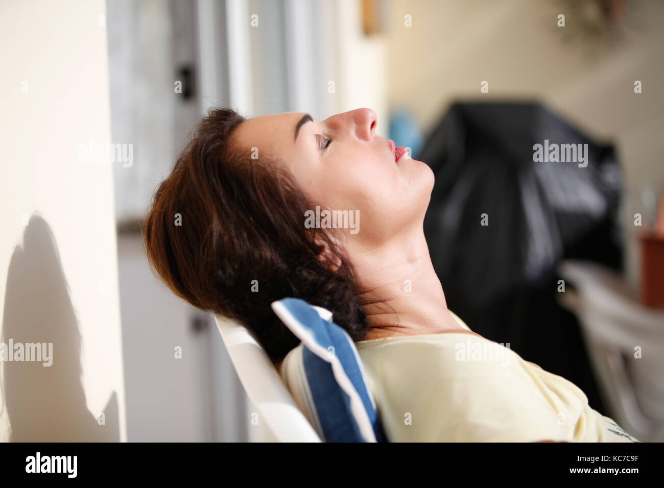 Woman relaxing in sunshine Stock Photo - Alamy