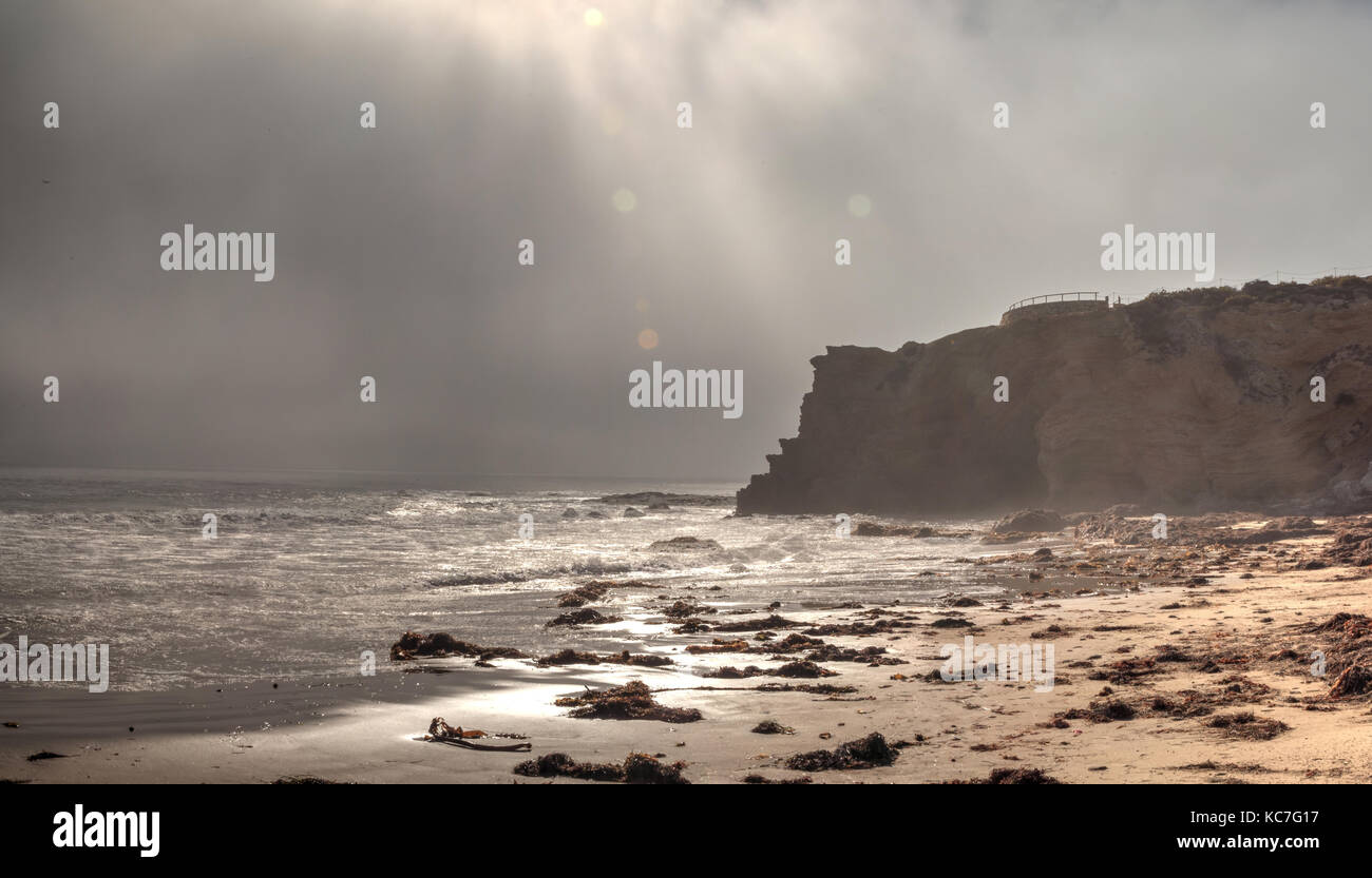 Fog drifts in over the ocean at Crystal Cove state beach on the edge of ...