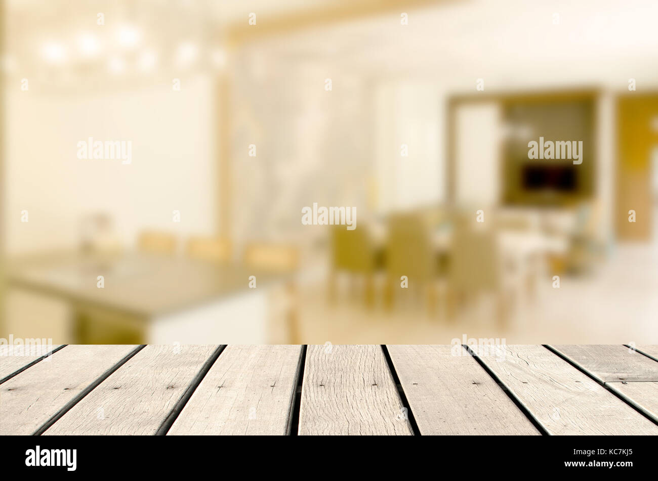 Wood table top blur living room interior background for product display ...