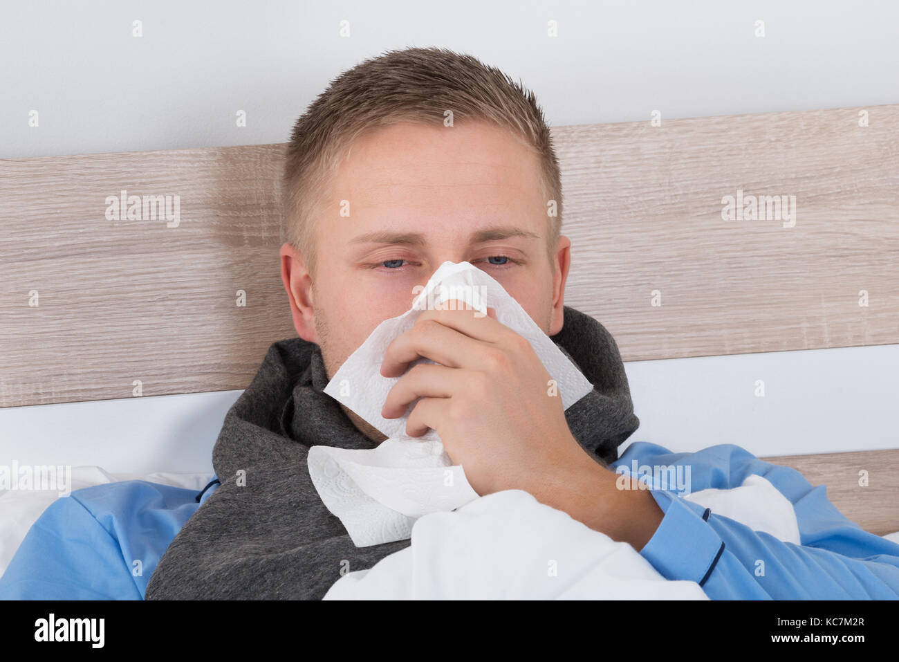 Portrait Of A Young Man With Nose Blowing Her Nose Stock Photo - Alamy