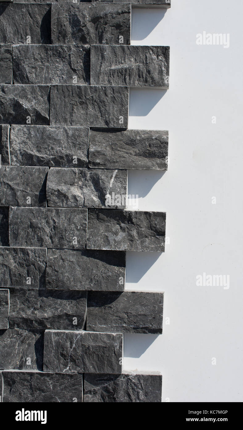 Decorative cubic stone wall as background texture Stock Photo - Alamy
