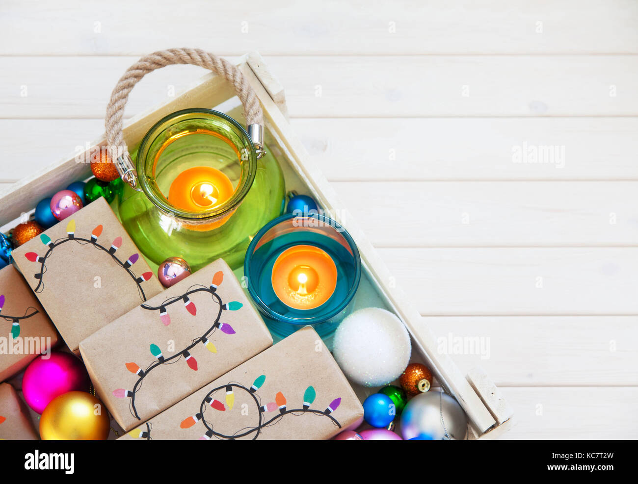 Gift boxes with festive garlands. Christmas decorations Stock Photo - Alamy