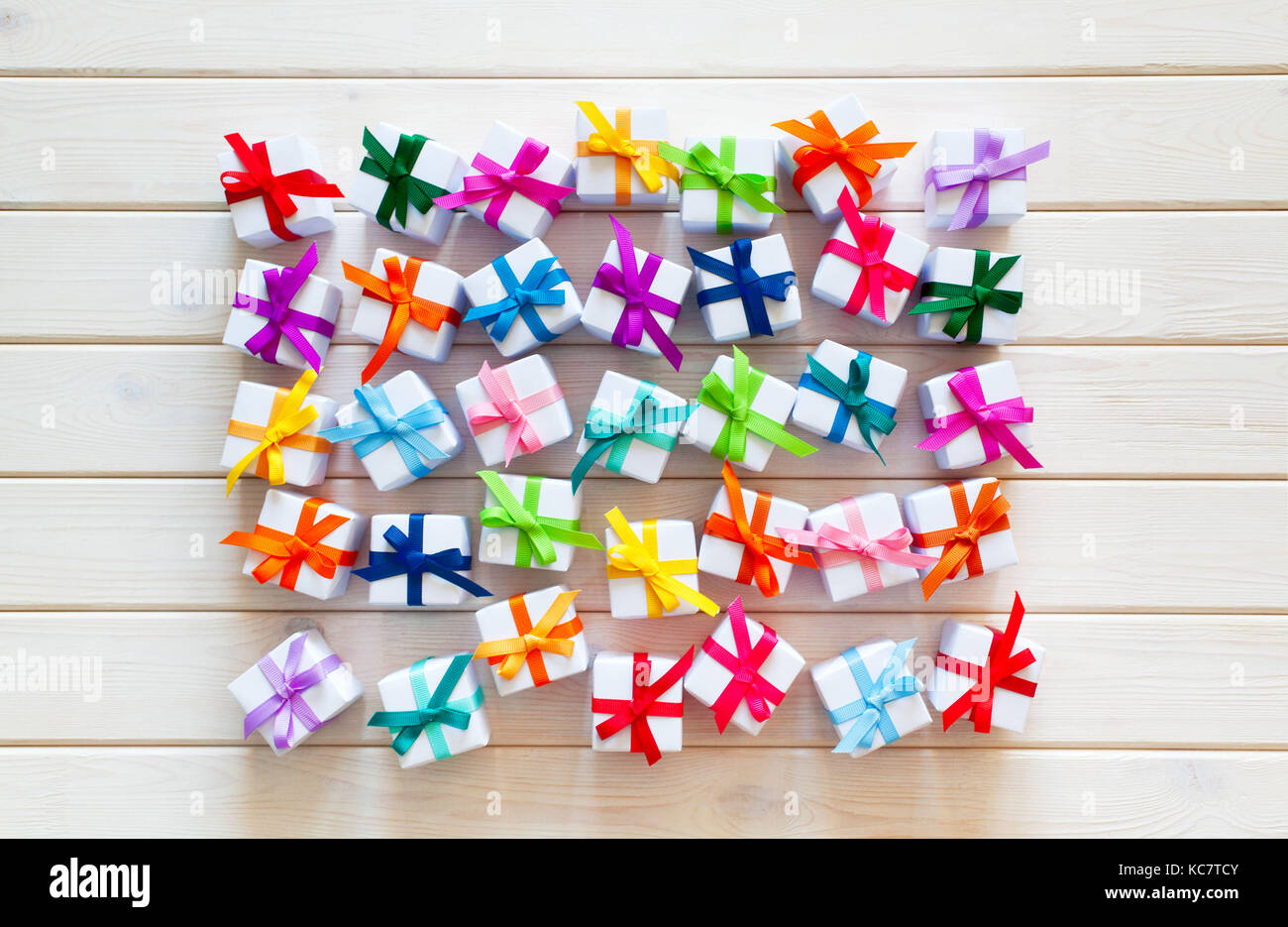 A lot of small gifts with color ribbons Stock Photo - Alamy
