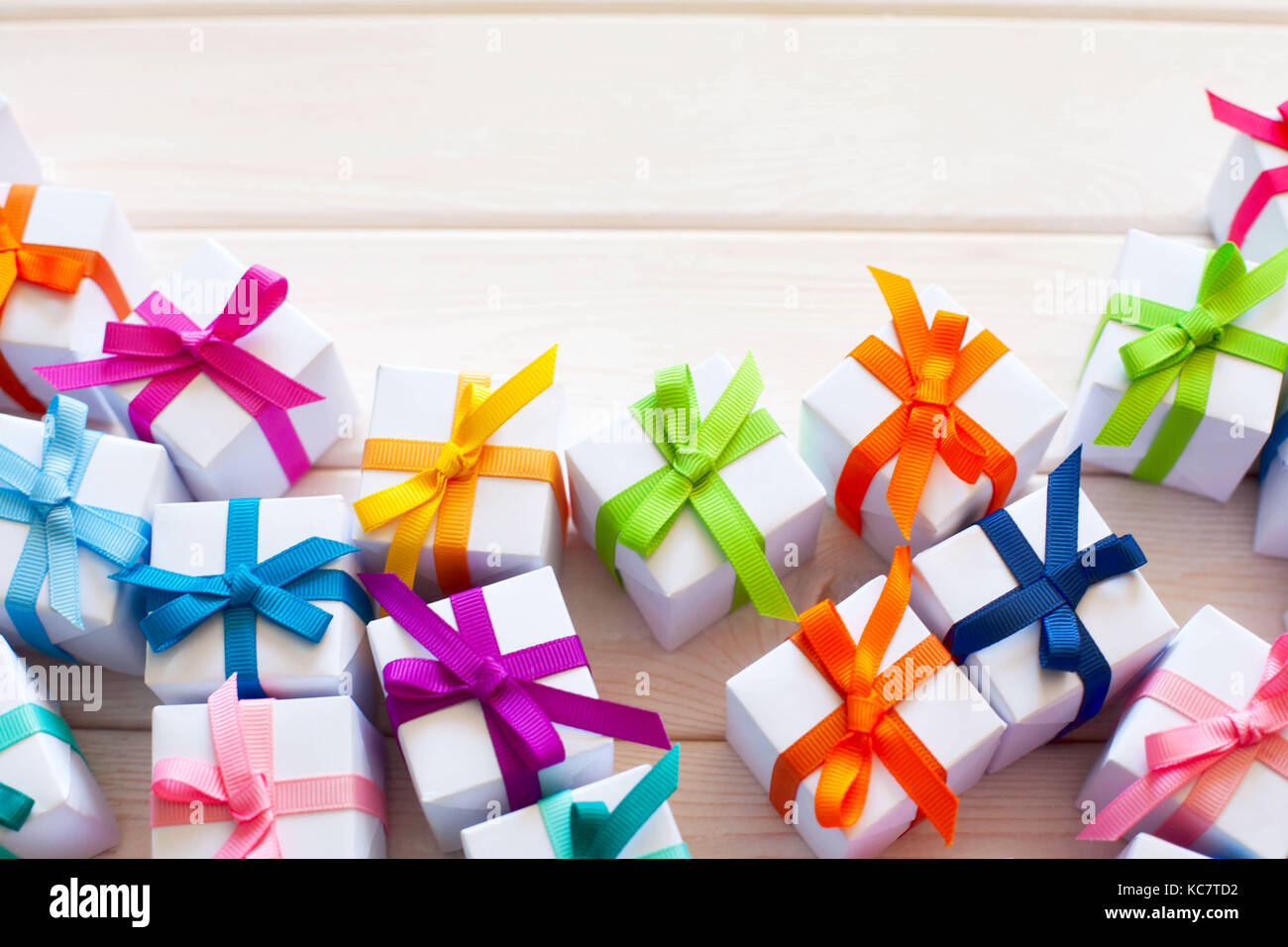 A lot of small gifts with color ribbons Stock Photo - Alamy