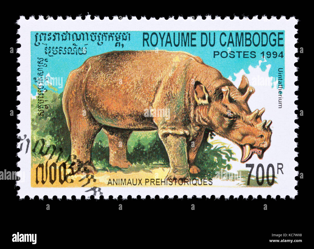 Postage stamp from Cambodia depicting a Uintatherium, a prehistoric ...