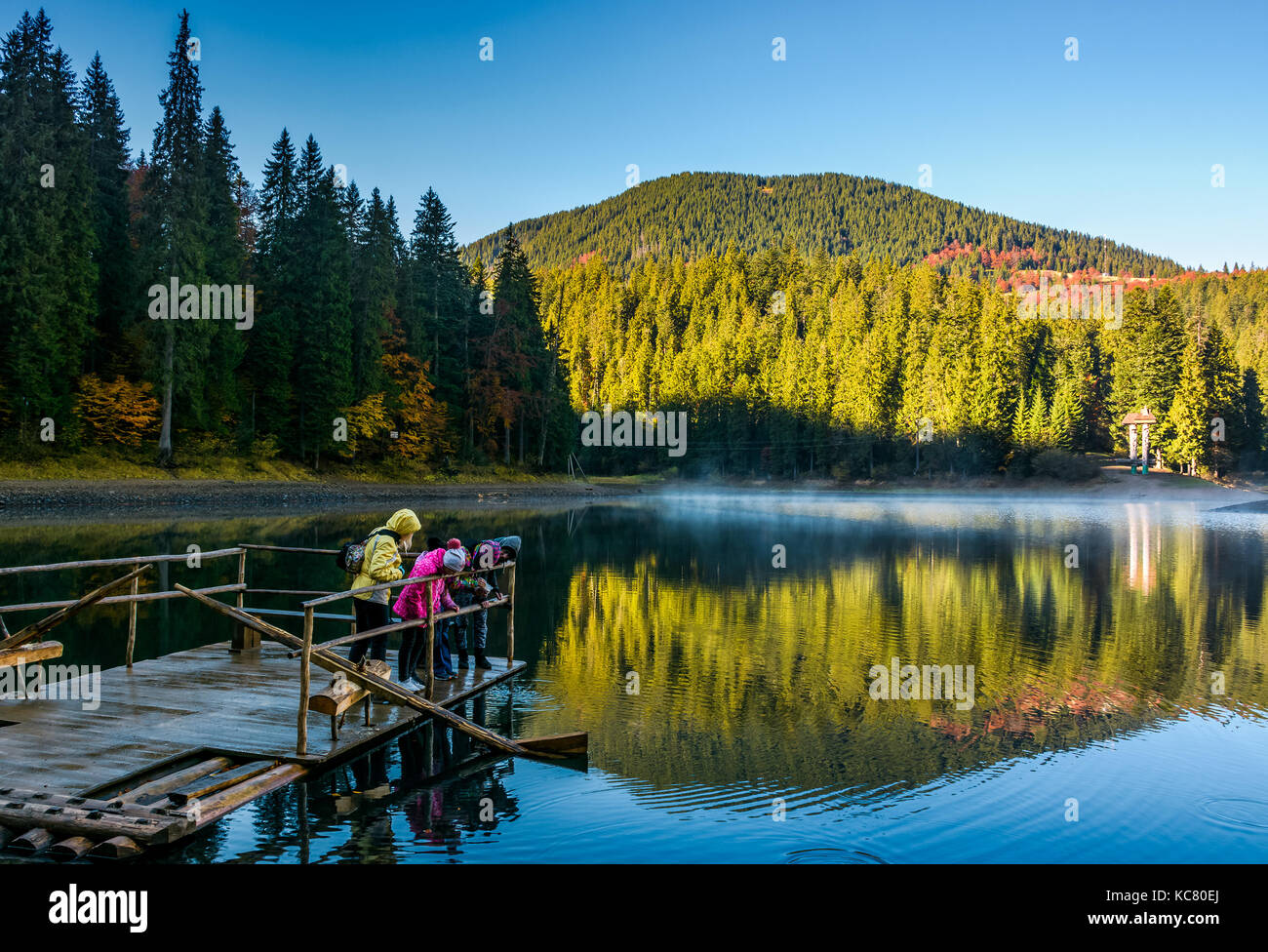 National Park Synevyr, Ukraine - October 23, 2016: tourists on Synevyr ...