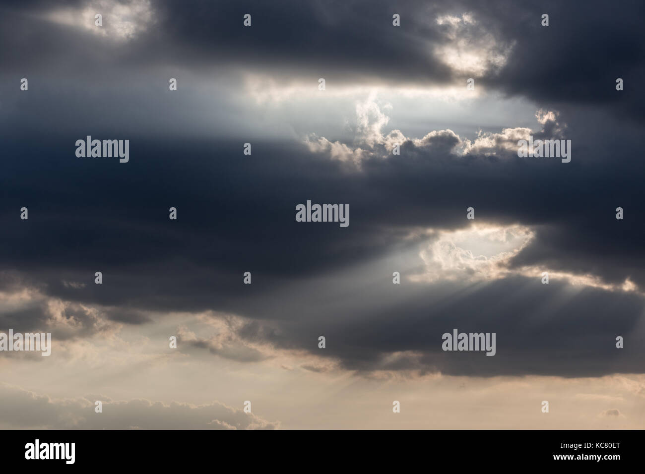 Sun coming through clouds hi-res stock photography and images - Alamy